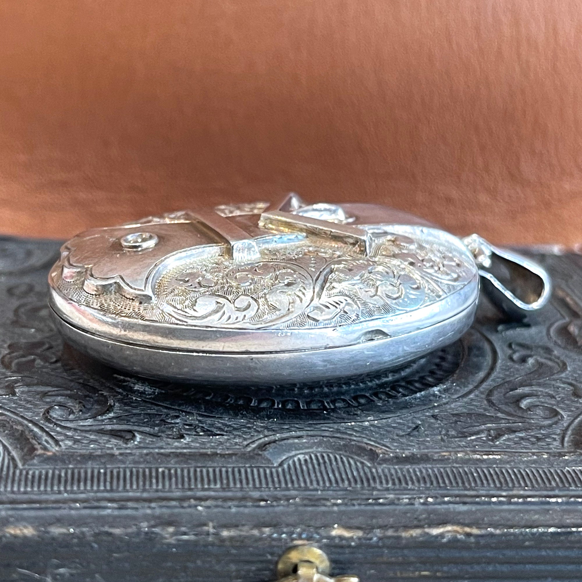 Silver Embossed Oval Buckle Locket Hallmarked 1883 - Victoria Sterling